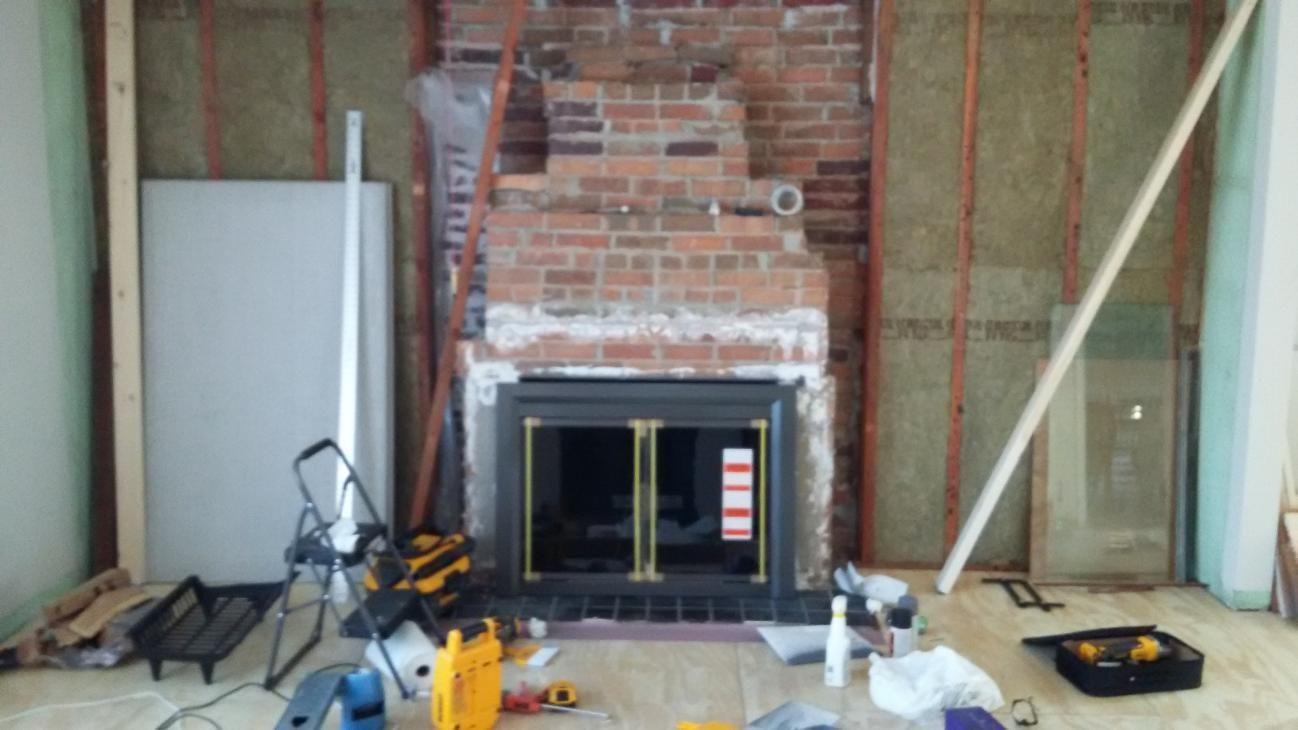 Frame around masonry fireplace for stone veneer... support ...