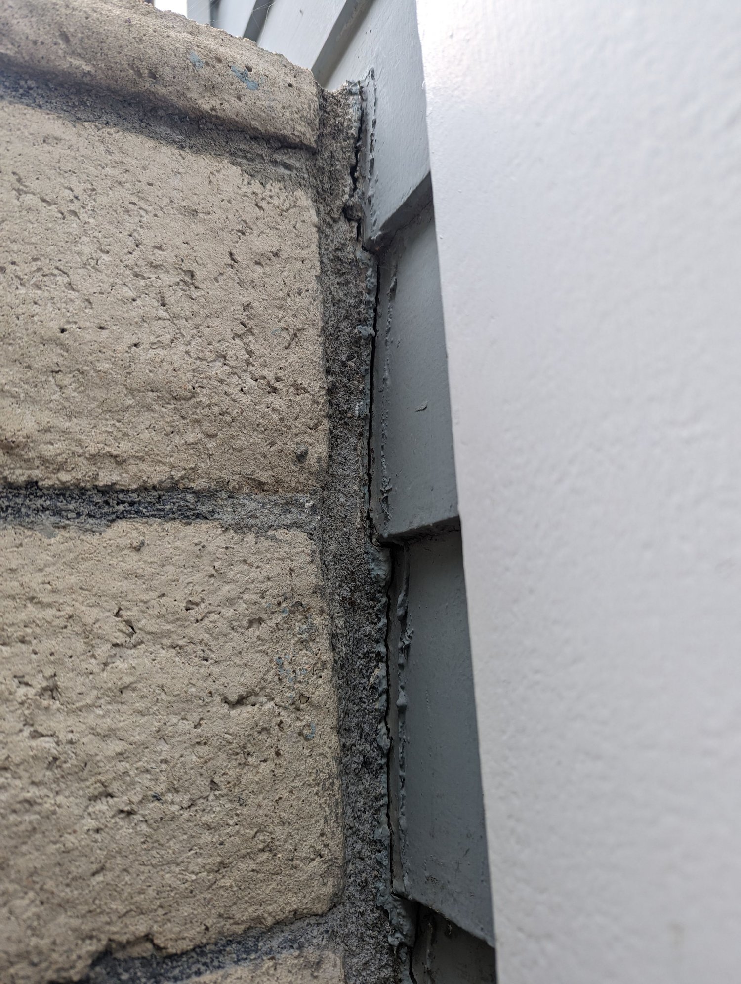 How to repair a leaning cinderblock column (attached to house and gate ...