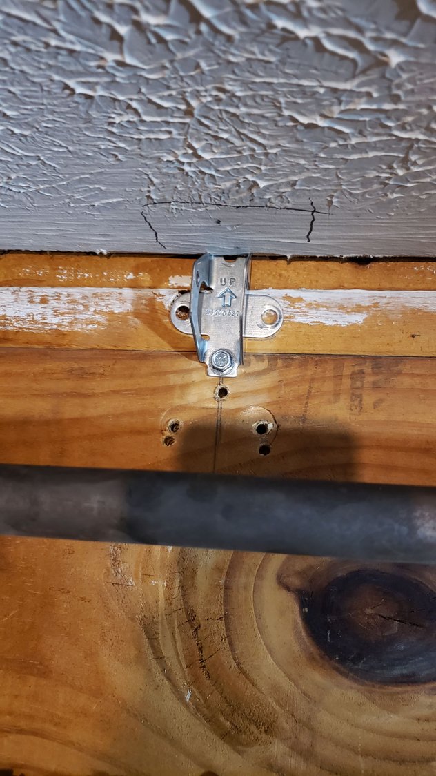 Garage door opener bracket clearance on header - DoItYourself.com ...