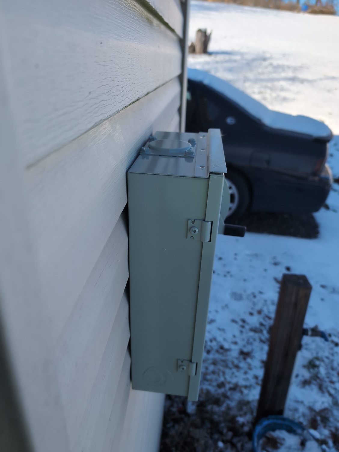 electric disconnect box mounted on vinyl siding. Caulk the top ...