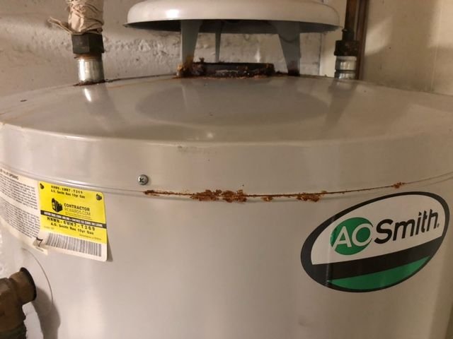 rusty things appearing on top of the hot water heater - DoItYourself ...