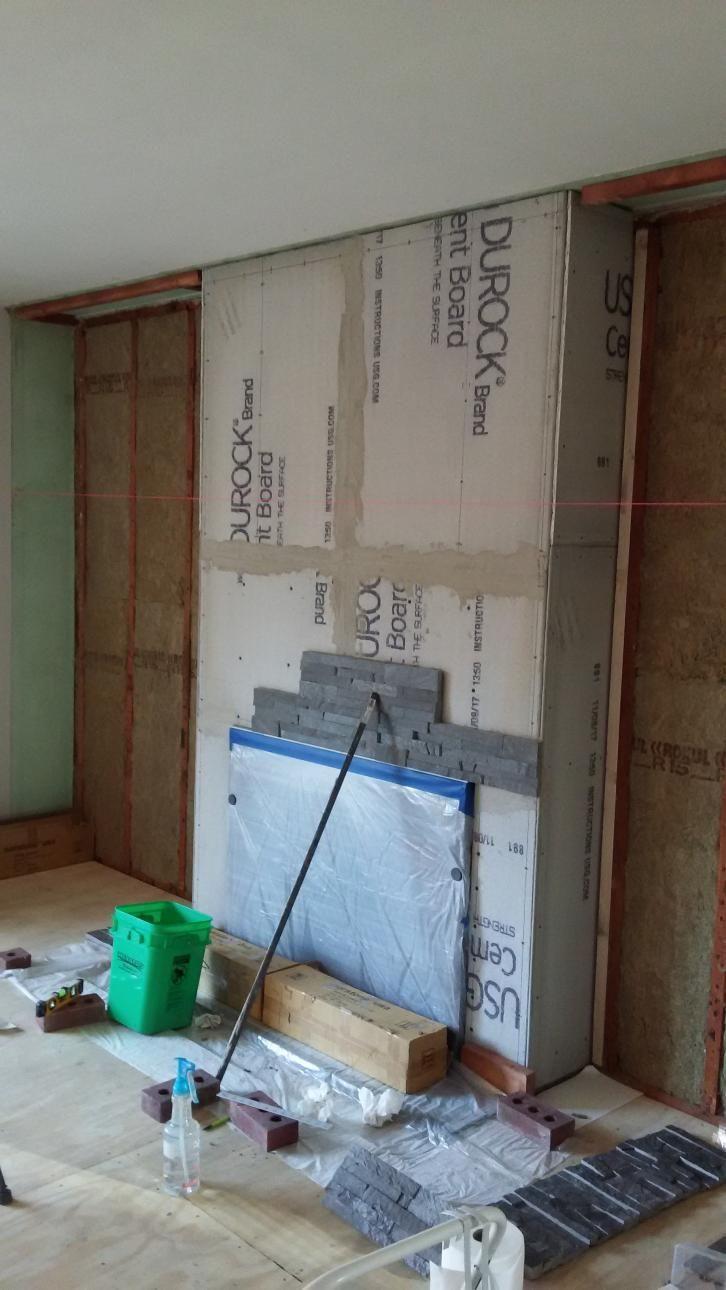 Frame around masonry fireplace for stone veneer... support ...